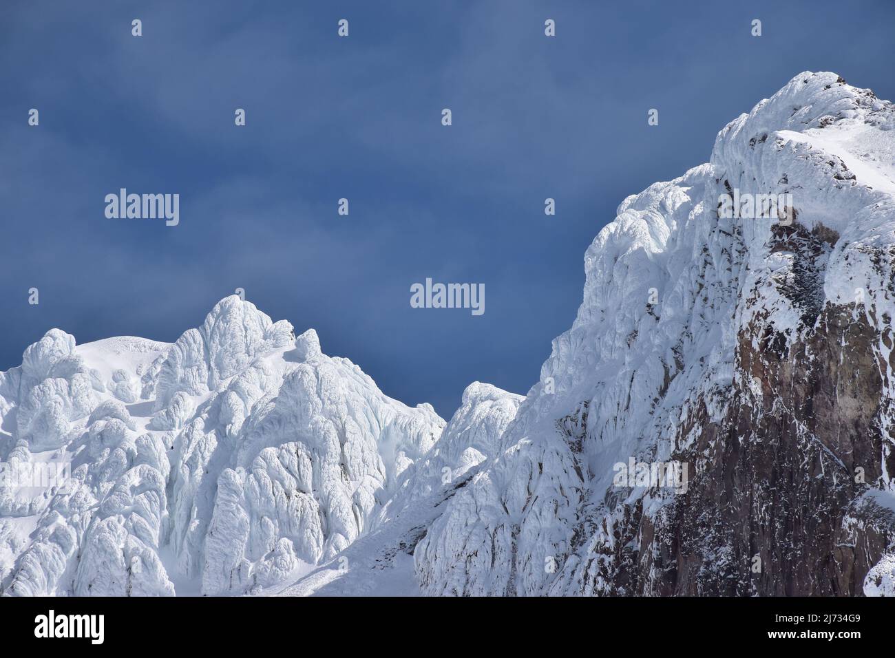 The steep icy summit area of Mt Hood, Oregon's highest mountain, seen ...