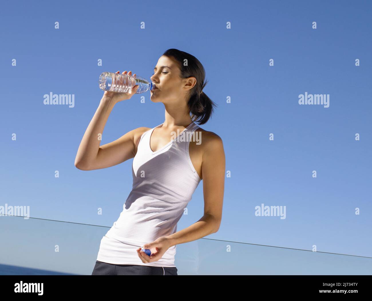 Caucasian brunette woman drinking water hi-res stock photography and ...