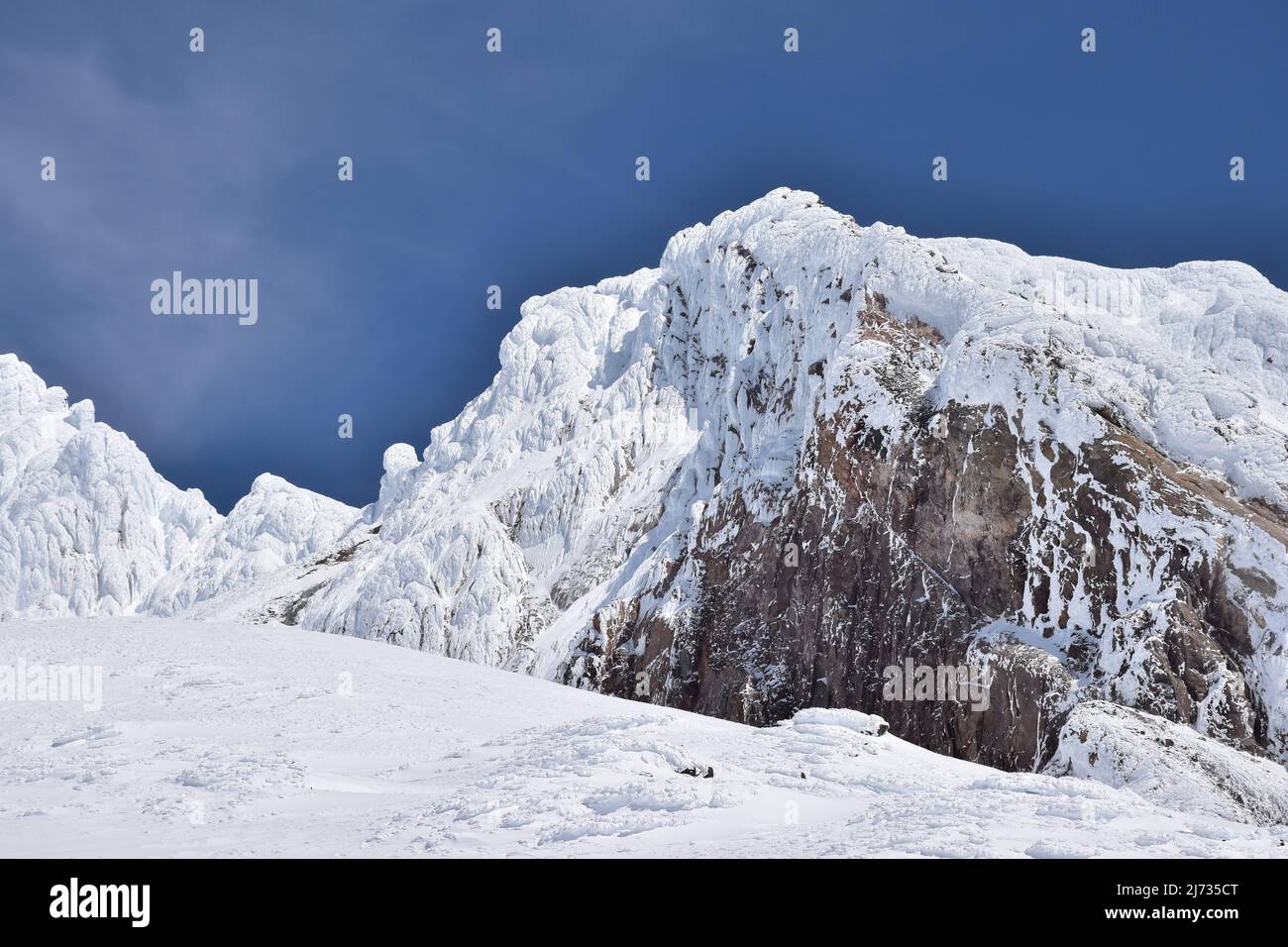 The steep icy summit area of Mt Hood, Oregon's highest mountain, seen ...