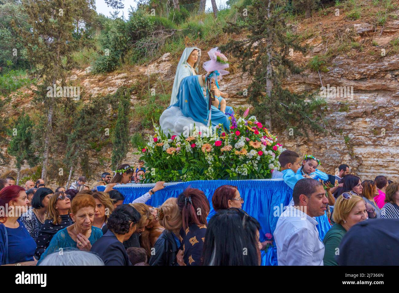 Haifa, Israel - May 01, 2022: Mary statue is pulled up the road by ...