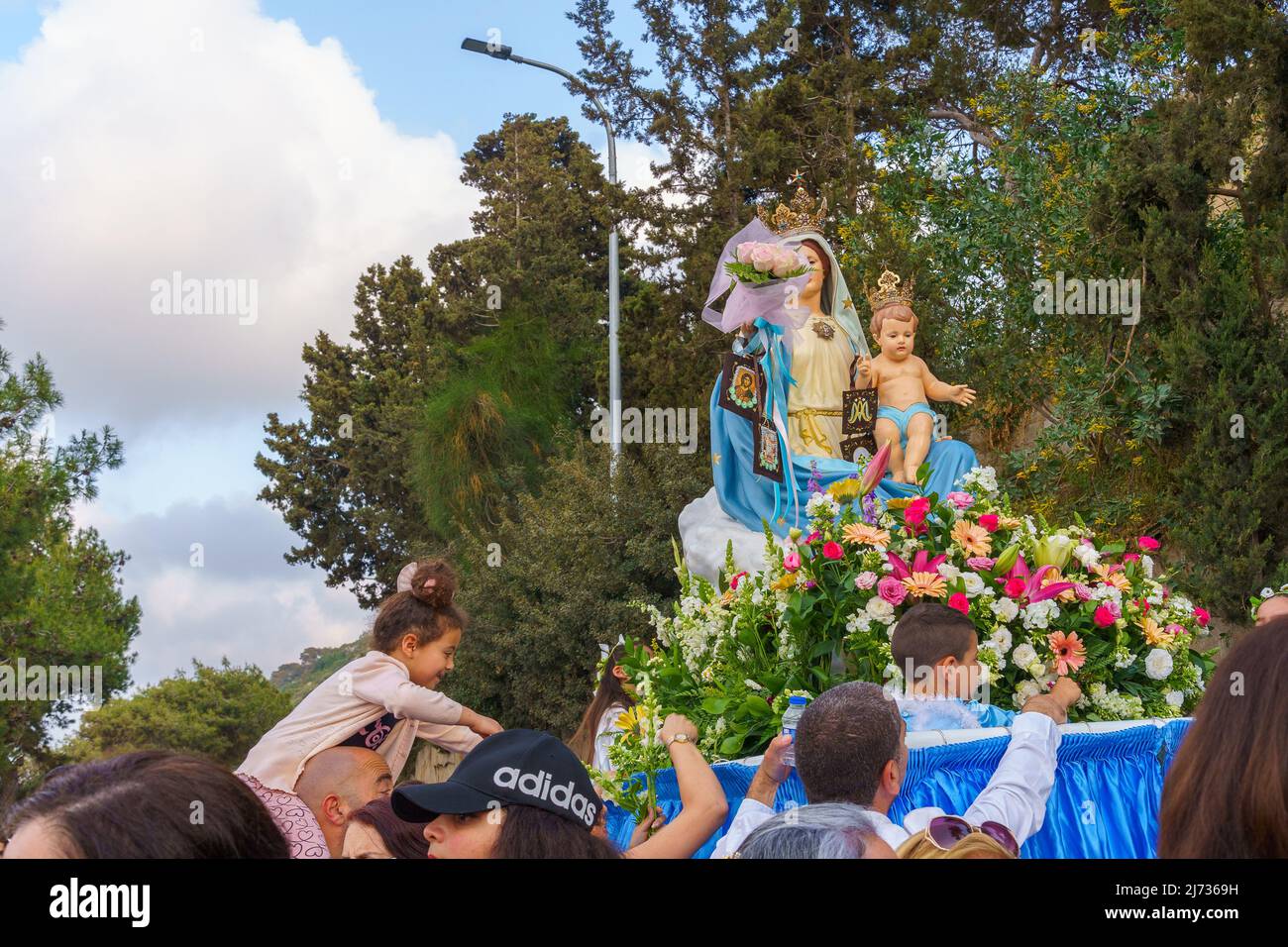 Haifa, Israel - May 01, 2022: Mary statue is pulled up the road by ...