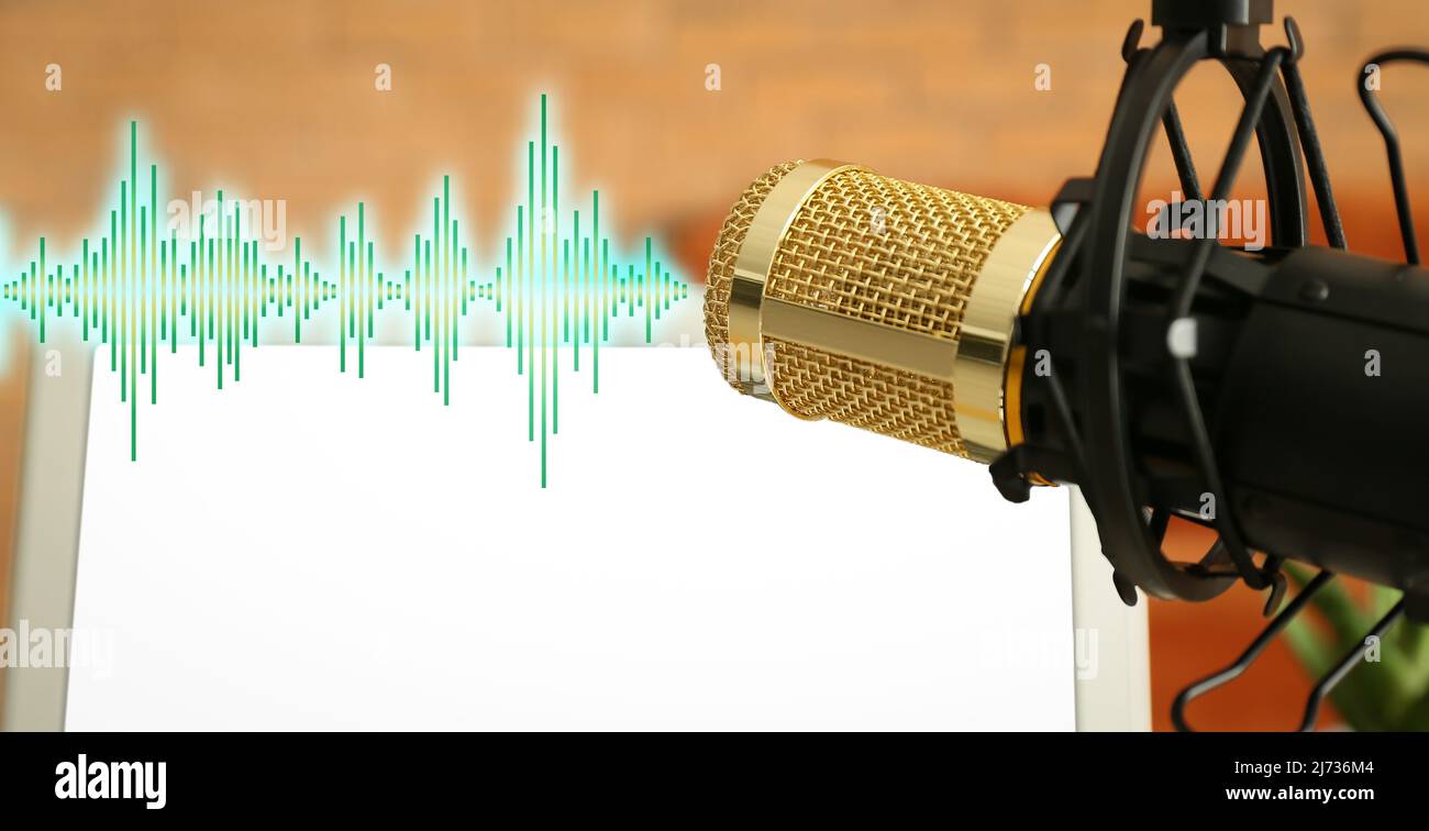Professional microphone and laptop in room, closeup Stock Photo - Alamy