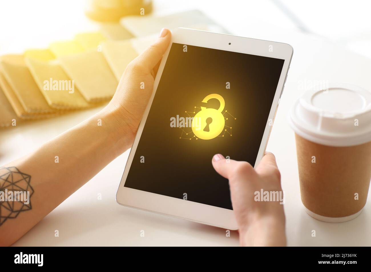 Young woman holding tablet computer with locked screen, closeup Stock ...