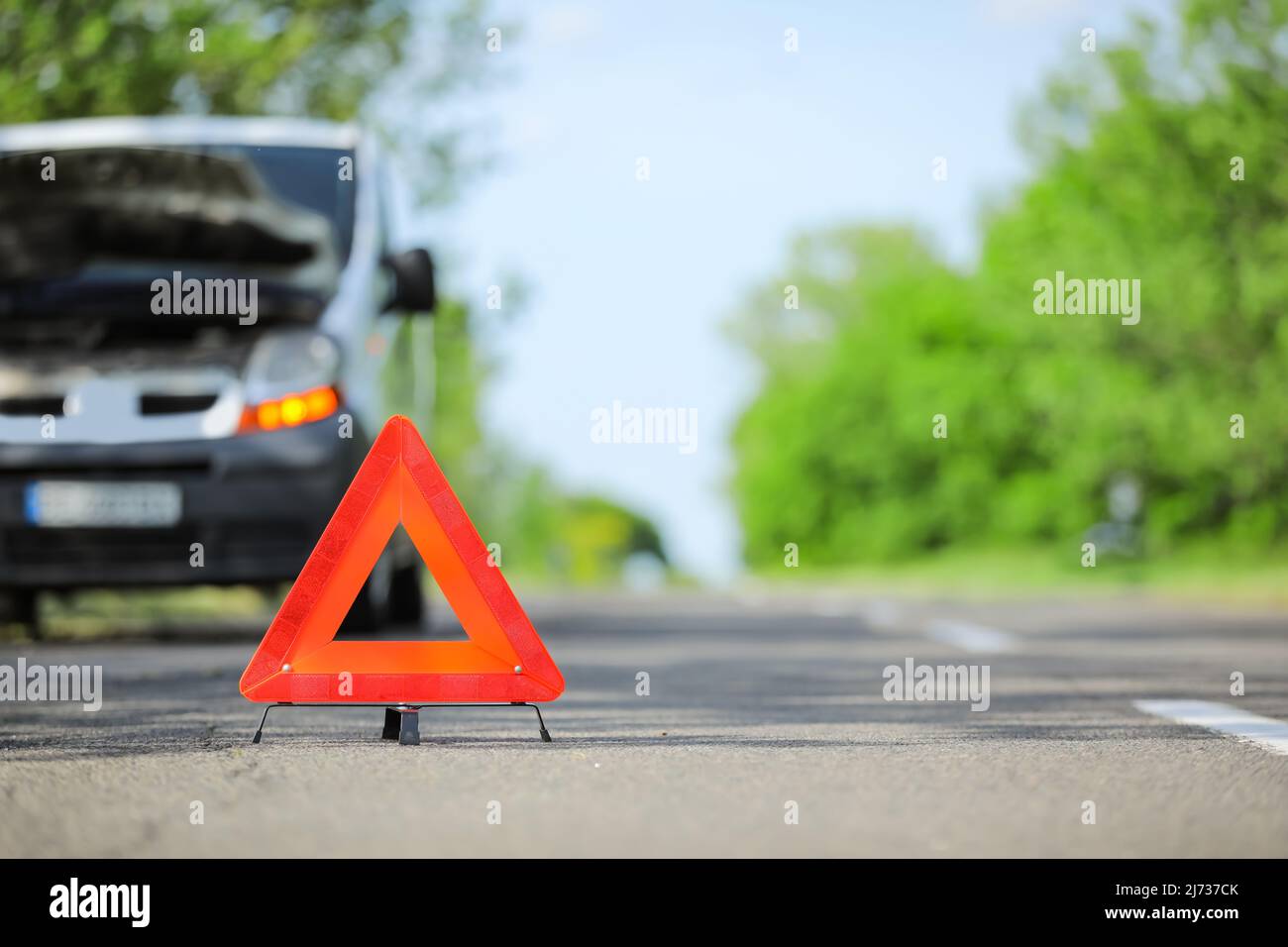 Emergency stop sign and broken car on background outdoors Stock Photo ...
