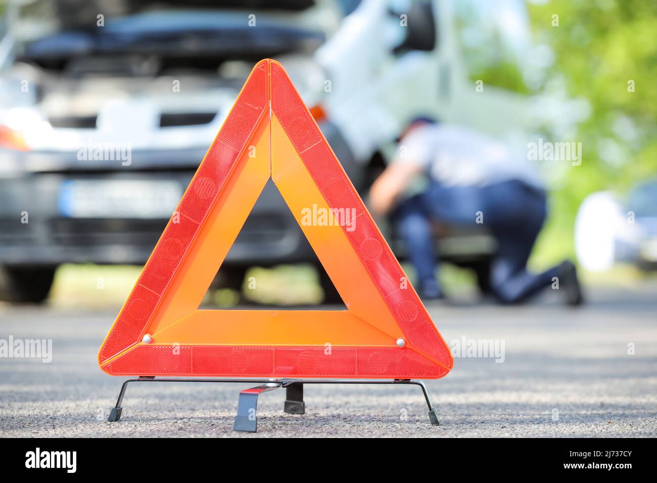 Red emergency stop sign on road, closeup Stock Photo - Alamy