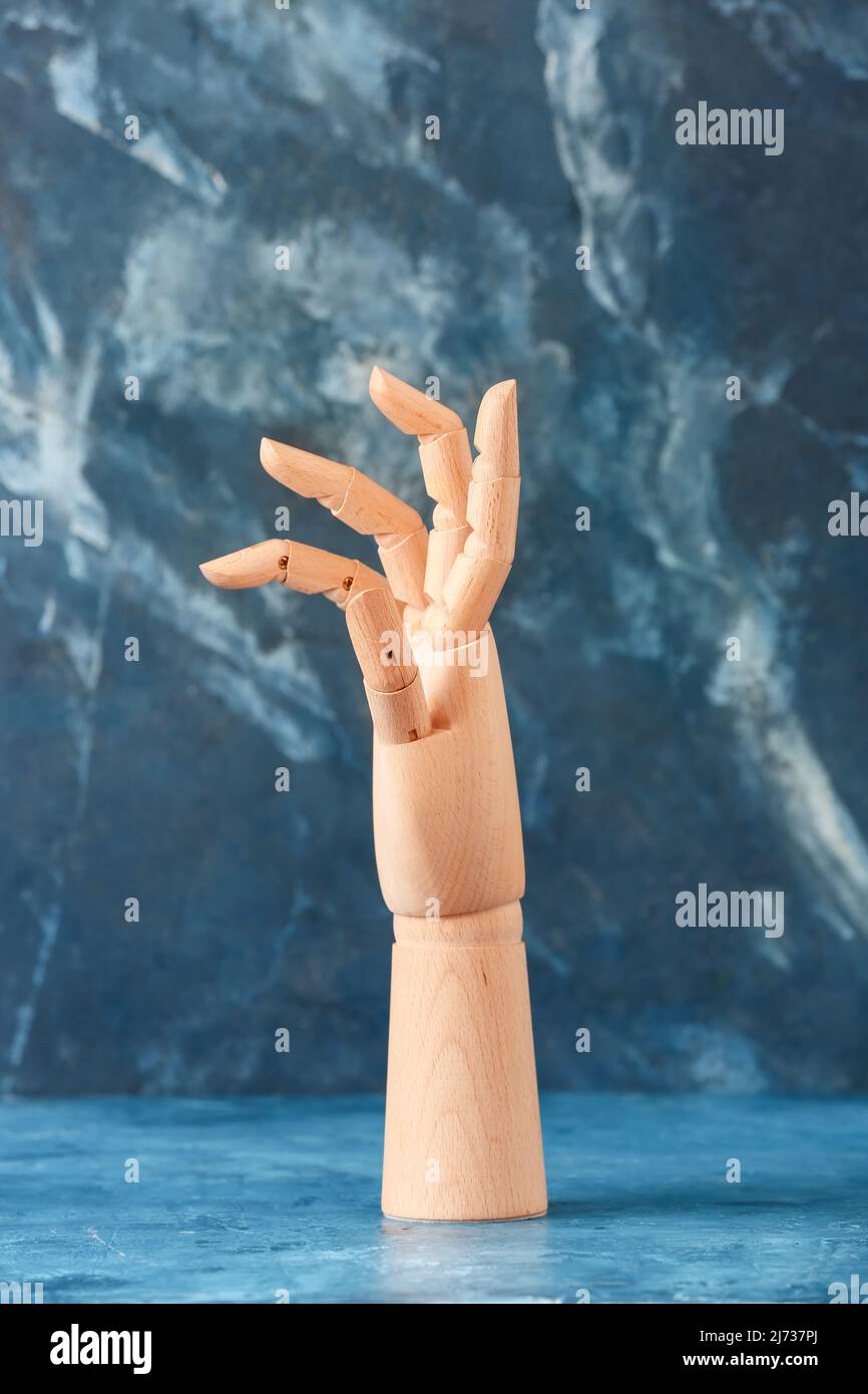 Wooden hand on grunge background Stock Photo - Alamy