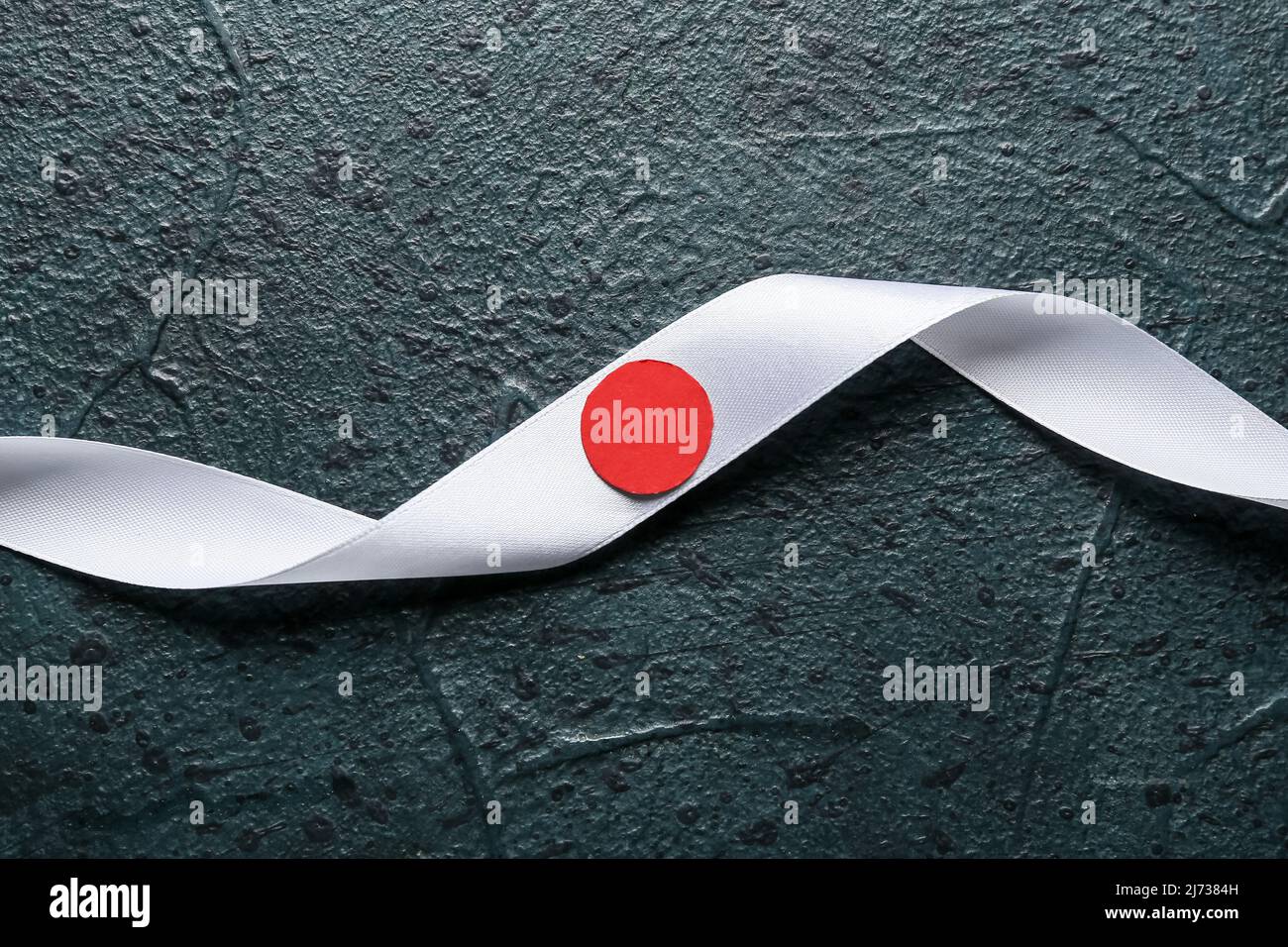 Japanese flag concept. Ribbon on dark background Stock Photo - Alamy