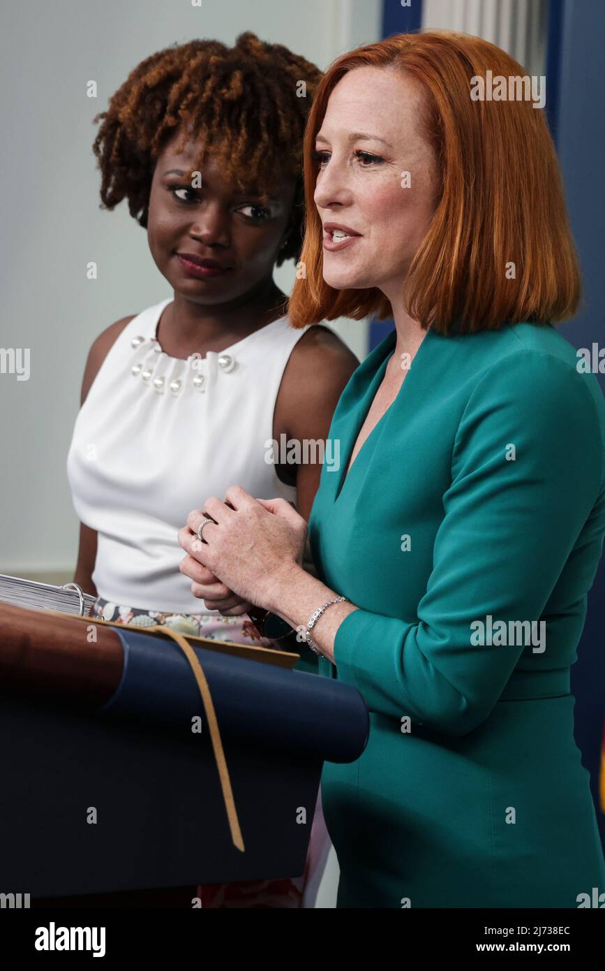 White House Press Secretary Jen Psaki, right, hold hands with current ...