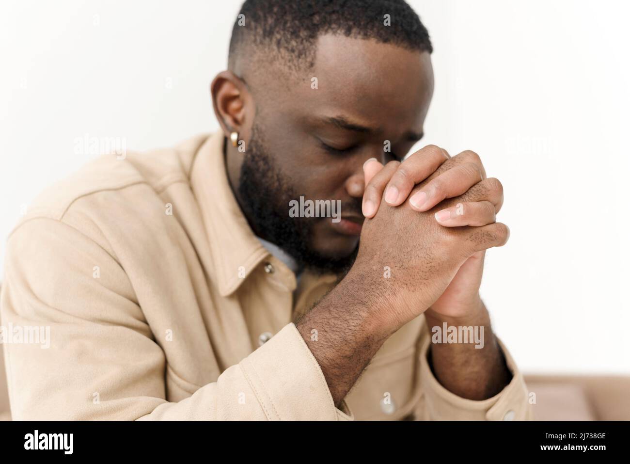 African man praying home hi-res stock photography and images - Alamy