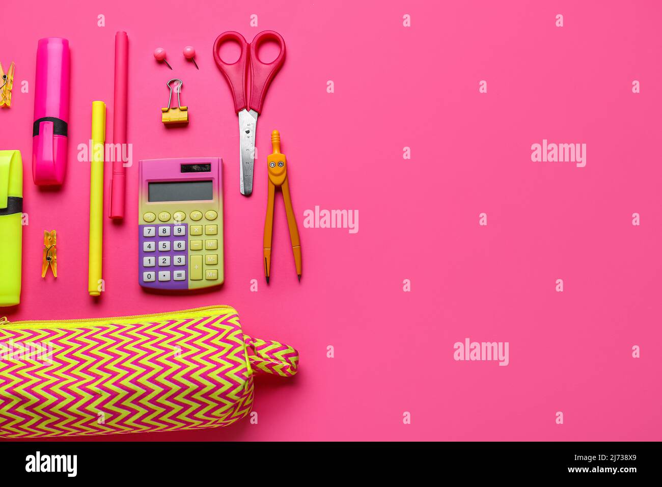 Bright pencil case with stationery supplies on pink background Stock ...