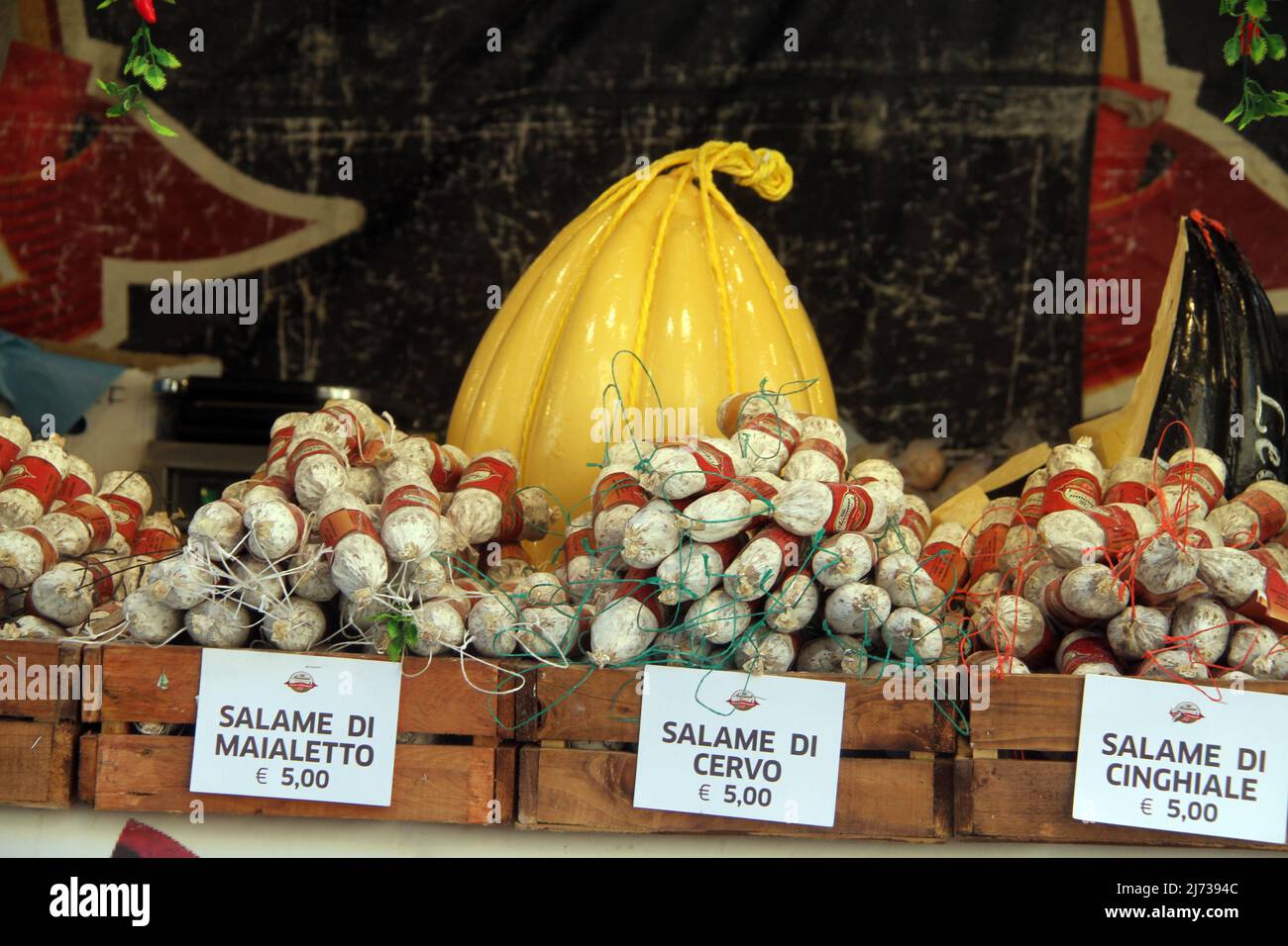 Traditional pig, deer and wild boar dry salami for sale on a street in ...