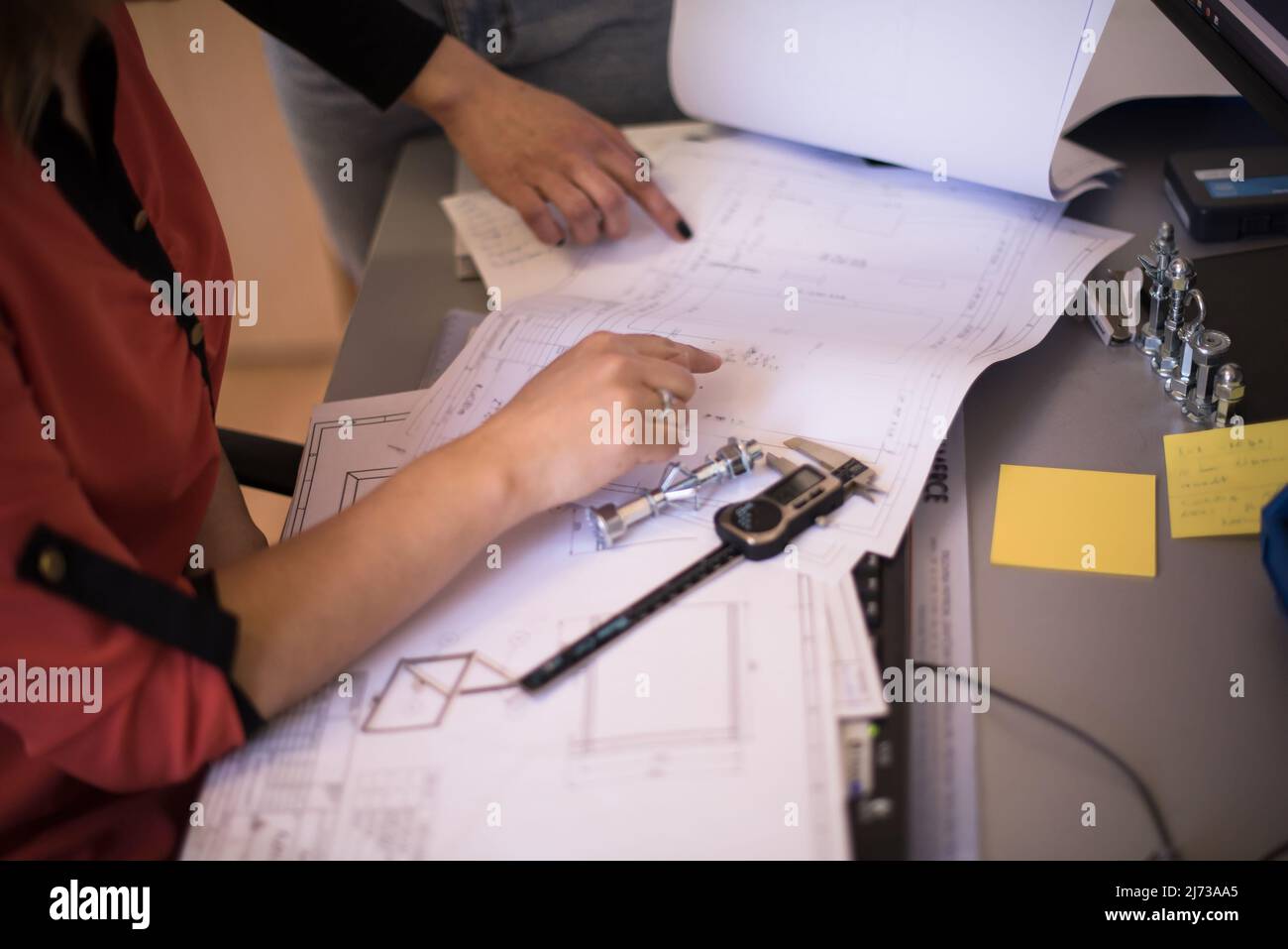 Engineer technician designing drawings mechanical parts engineering ...