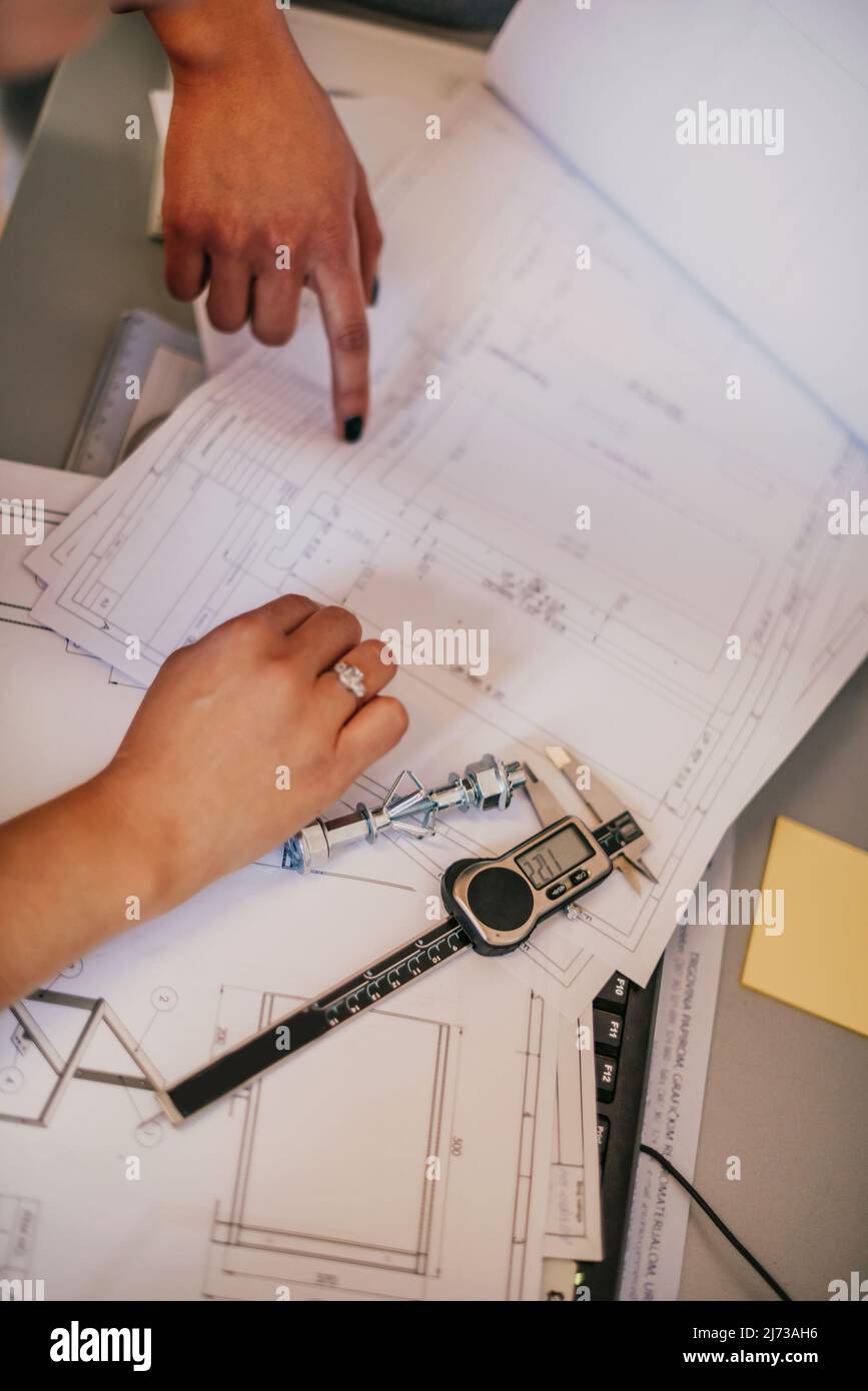 Engineer technician designing drawings mechanical parts engineering ...