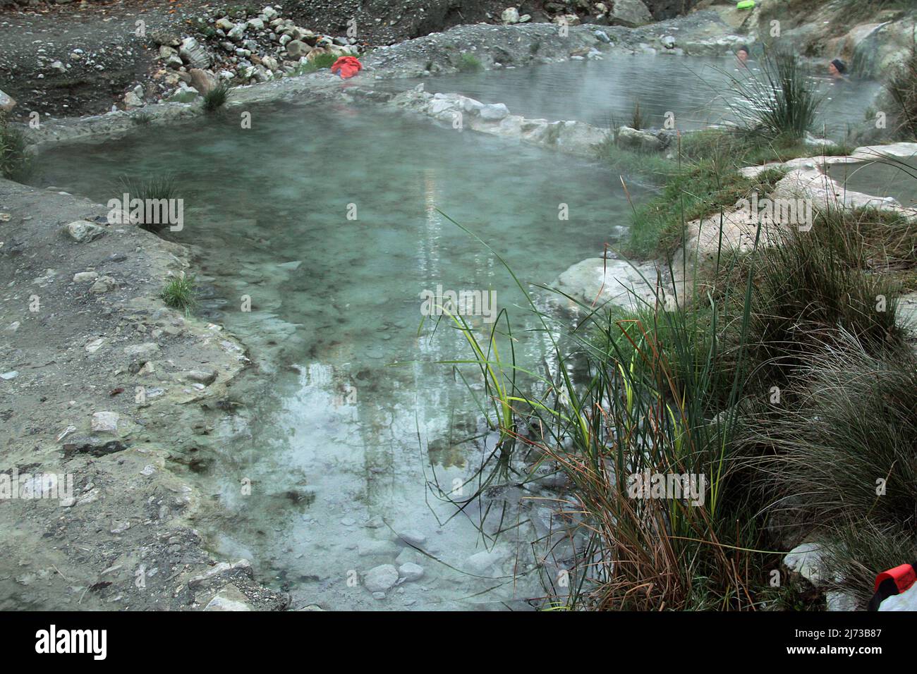 People bathing in the pools at the famous Bagni San Filippo, Italy, in ...