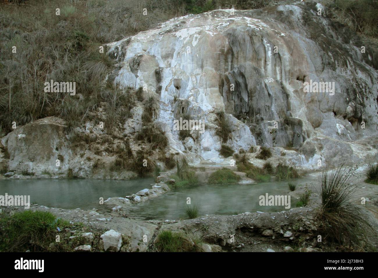 Bagni San Filippo, Tuscany, Italy. Large block of limestone by the ...