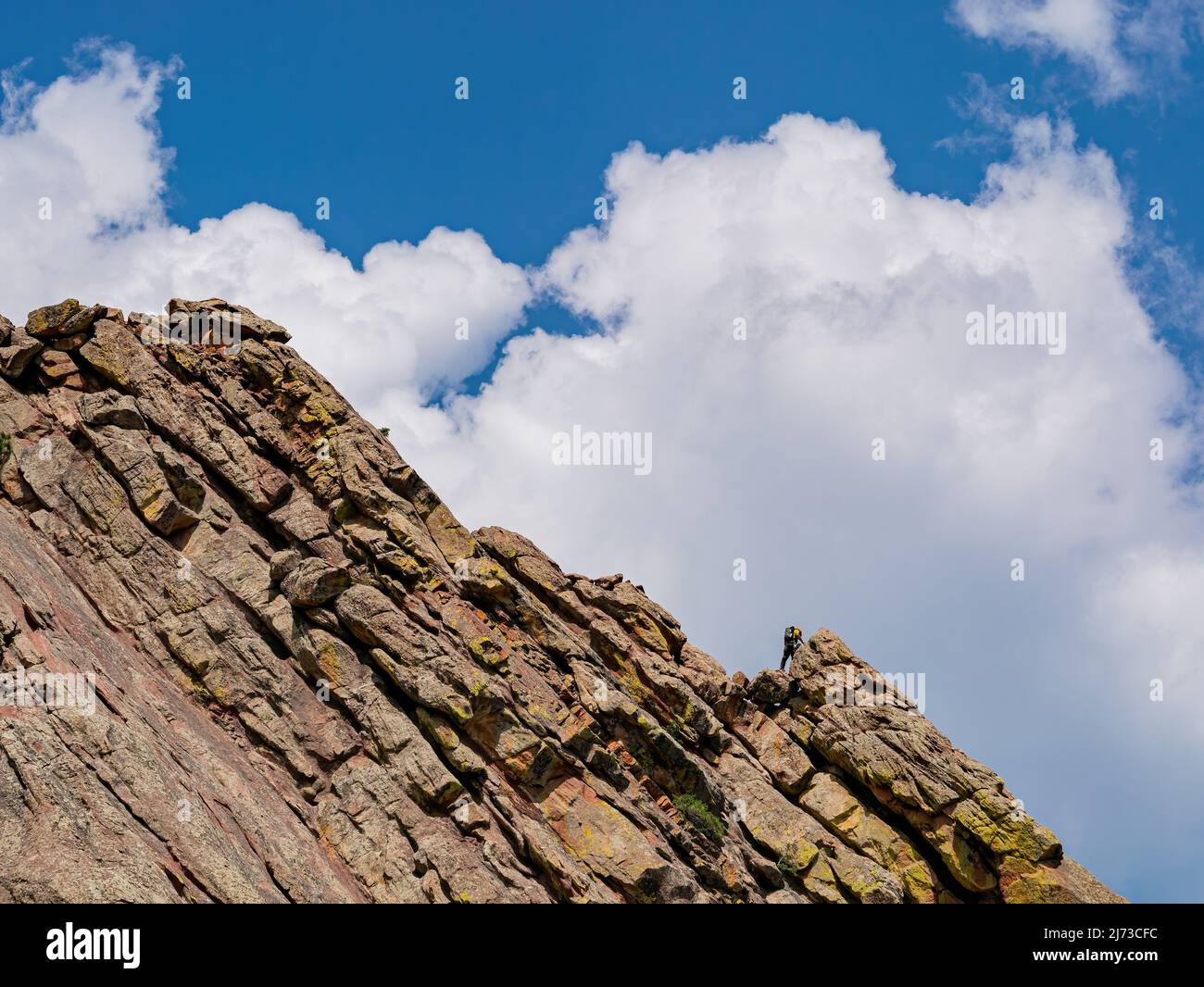 People playing rock climbing on the Flatirons at Colorado Stock Photo ...