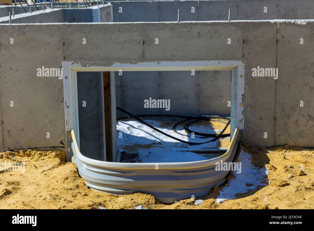 Building unfinished construction window well for basement Stock Photo ...