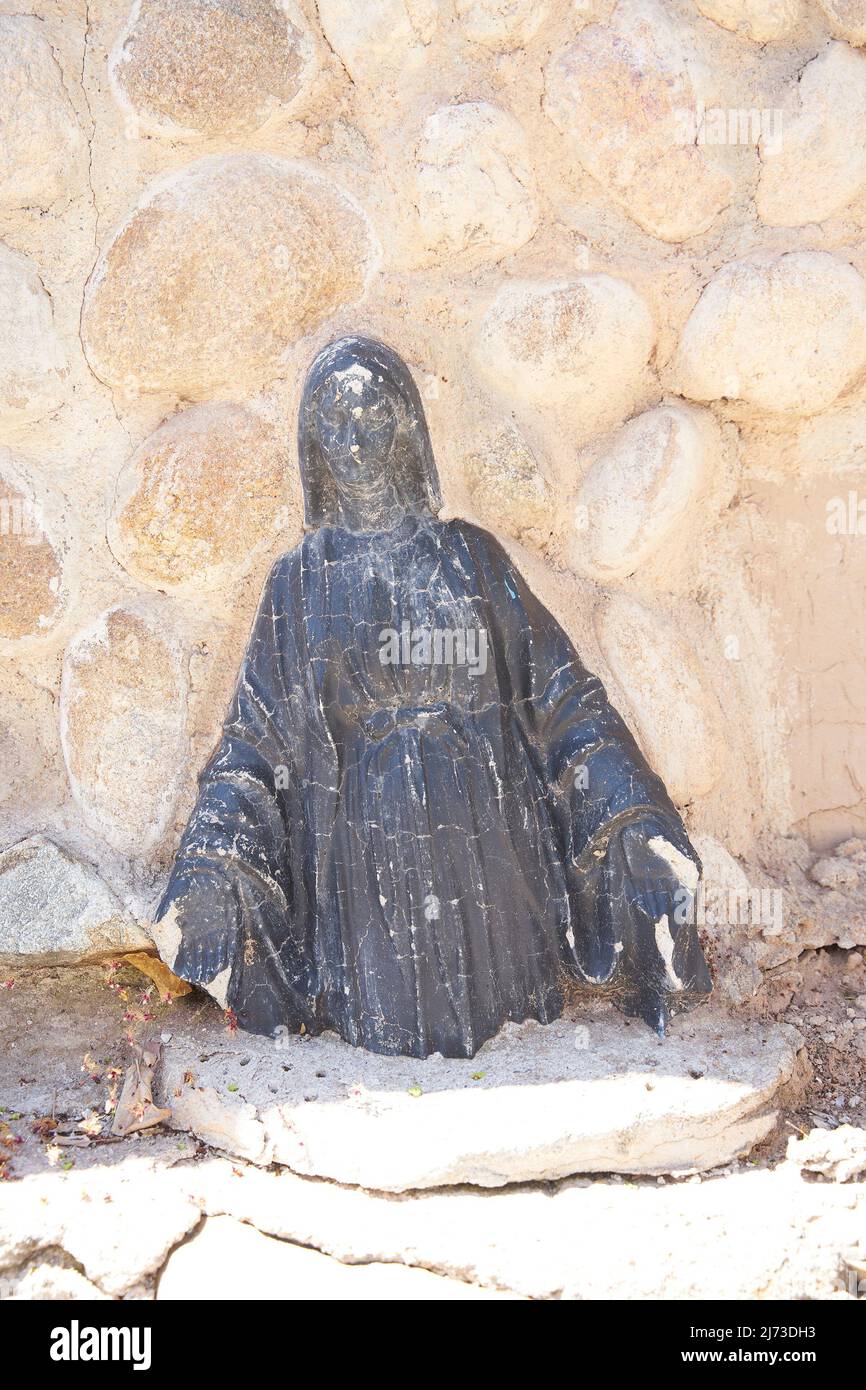 Folk art outdoor sculpture of torso of Virgin Mary statue in Chimayo ...
