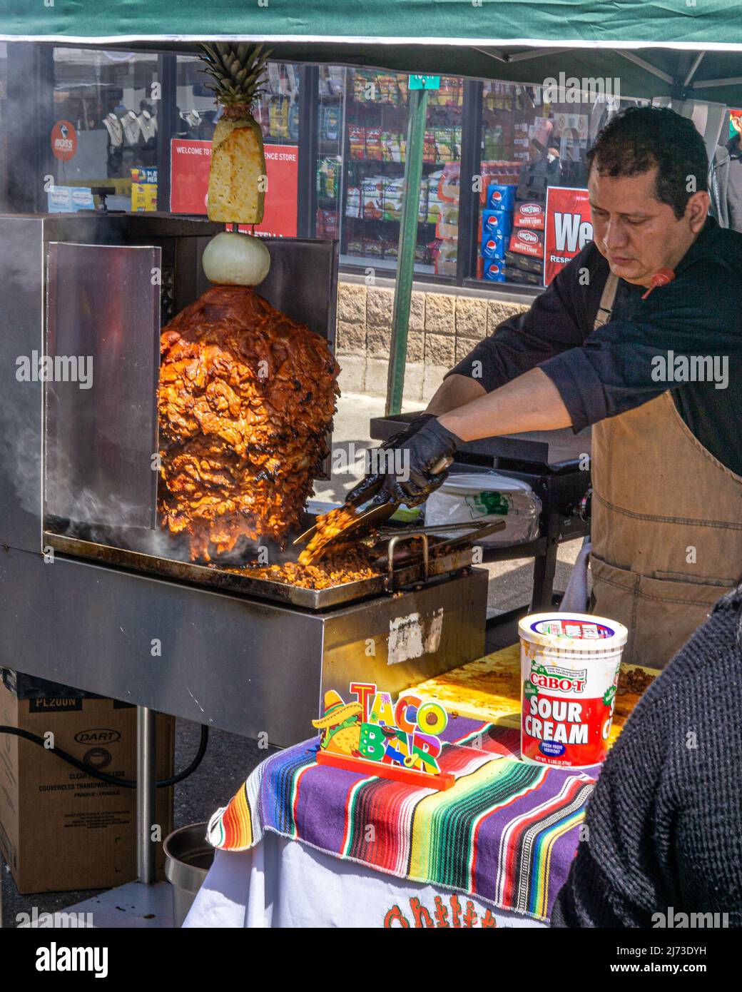 Suffern, NY - USA - May 1, 2022: View of street food being prepared for ...