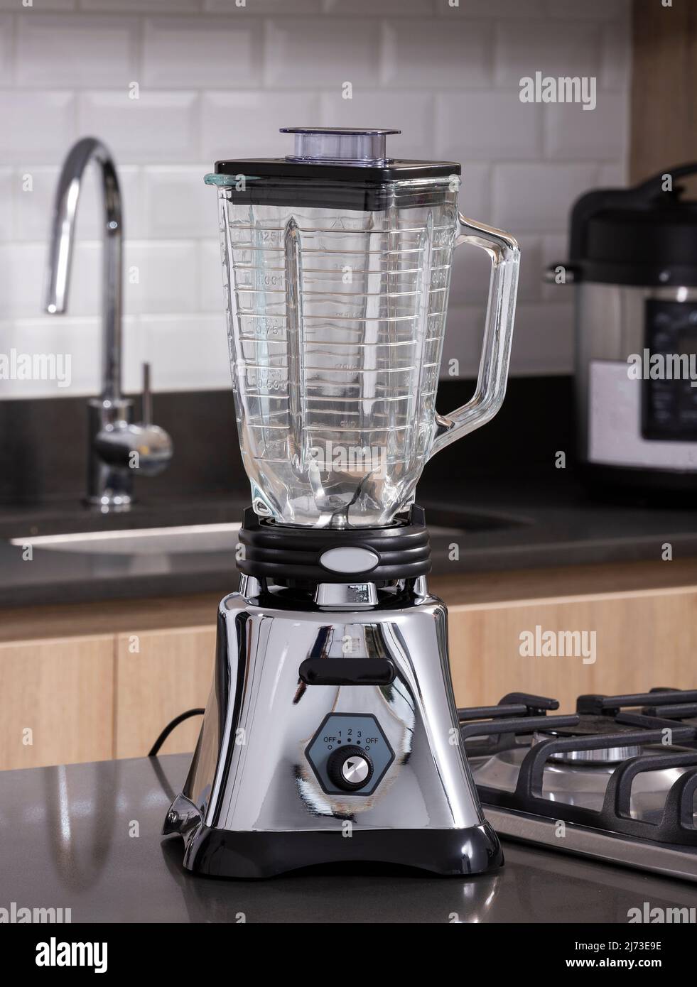 Modern silver blender - Kitchen backdrop Stock Photo - Alamy