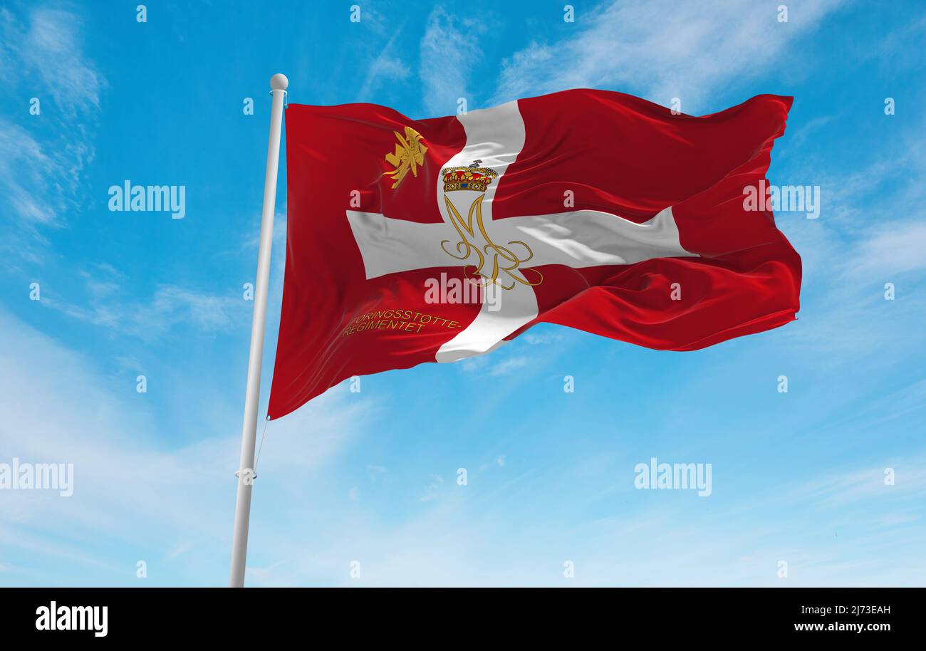official flag of Signal Regiment , Denmark at cloudy sky background on ...