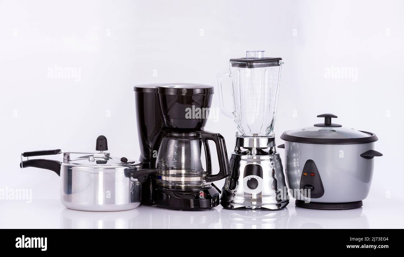 Modern small kitchen appliances on neutral background Stock Photo - Alamy