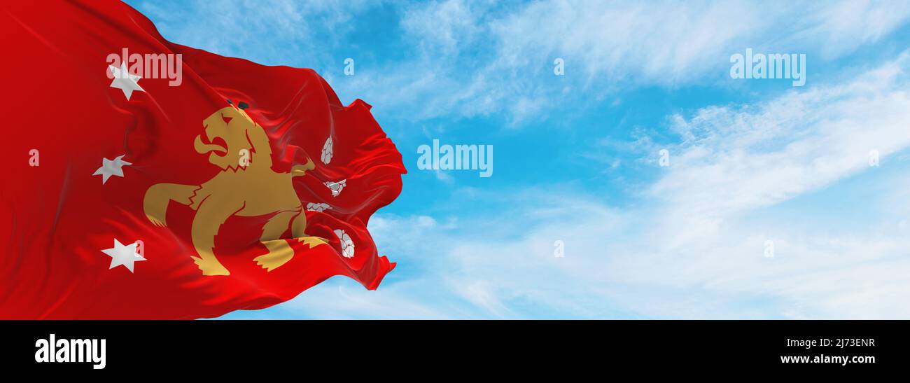 official flag of Tavastia Proper , Finland at cloudy sky background on ...