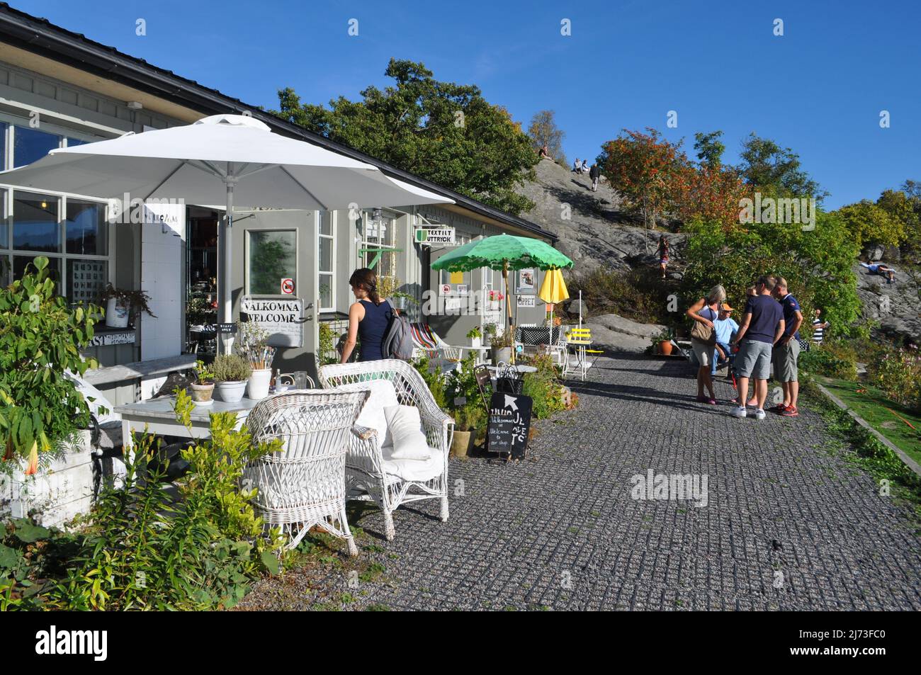 Shops and a cafe in a snapshot of summer island life in Stockholm ...