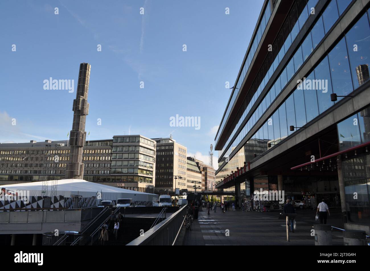 People walking on the street amid a landscape of functional modern ...