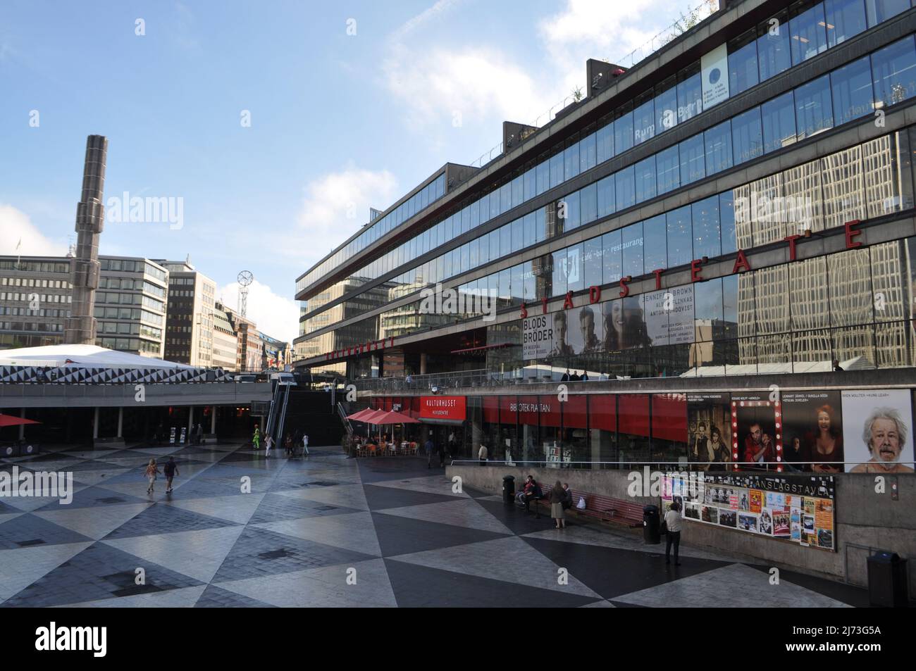 People walking on the street amid a landscape of functional modern ...