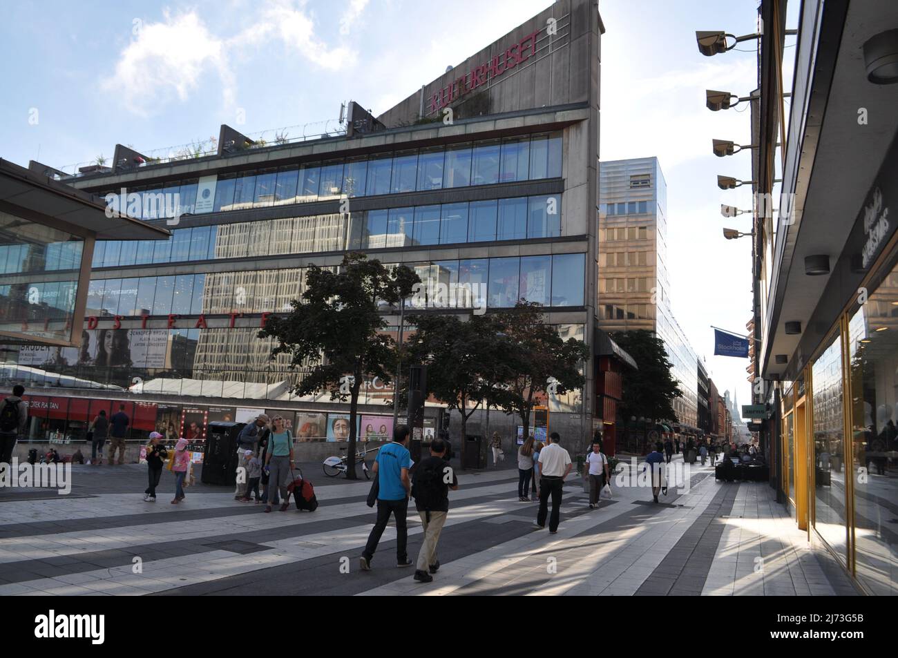 People walking on the street amid a landscape of functional modern ...