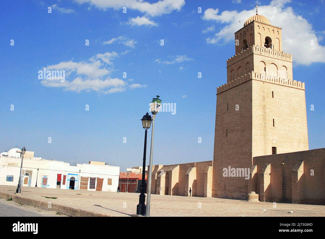 Tunisian mosque tower in the sunshine Stock Photo - Alamy