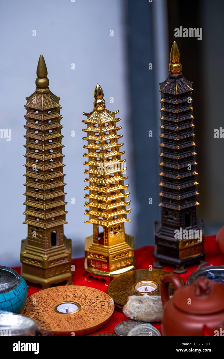 Traditional Chinese metal pagoda for sale in the market Stock Photo - Alamy