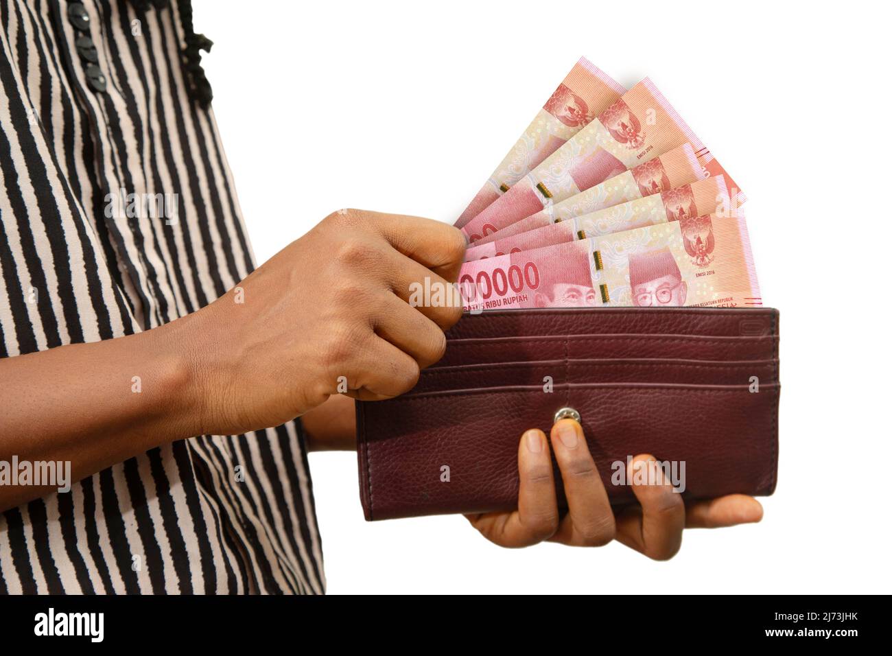 Hand Holding brown Purse With Indonesian rupiah notes, hand removing ...
