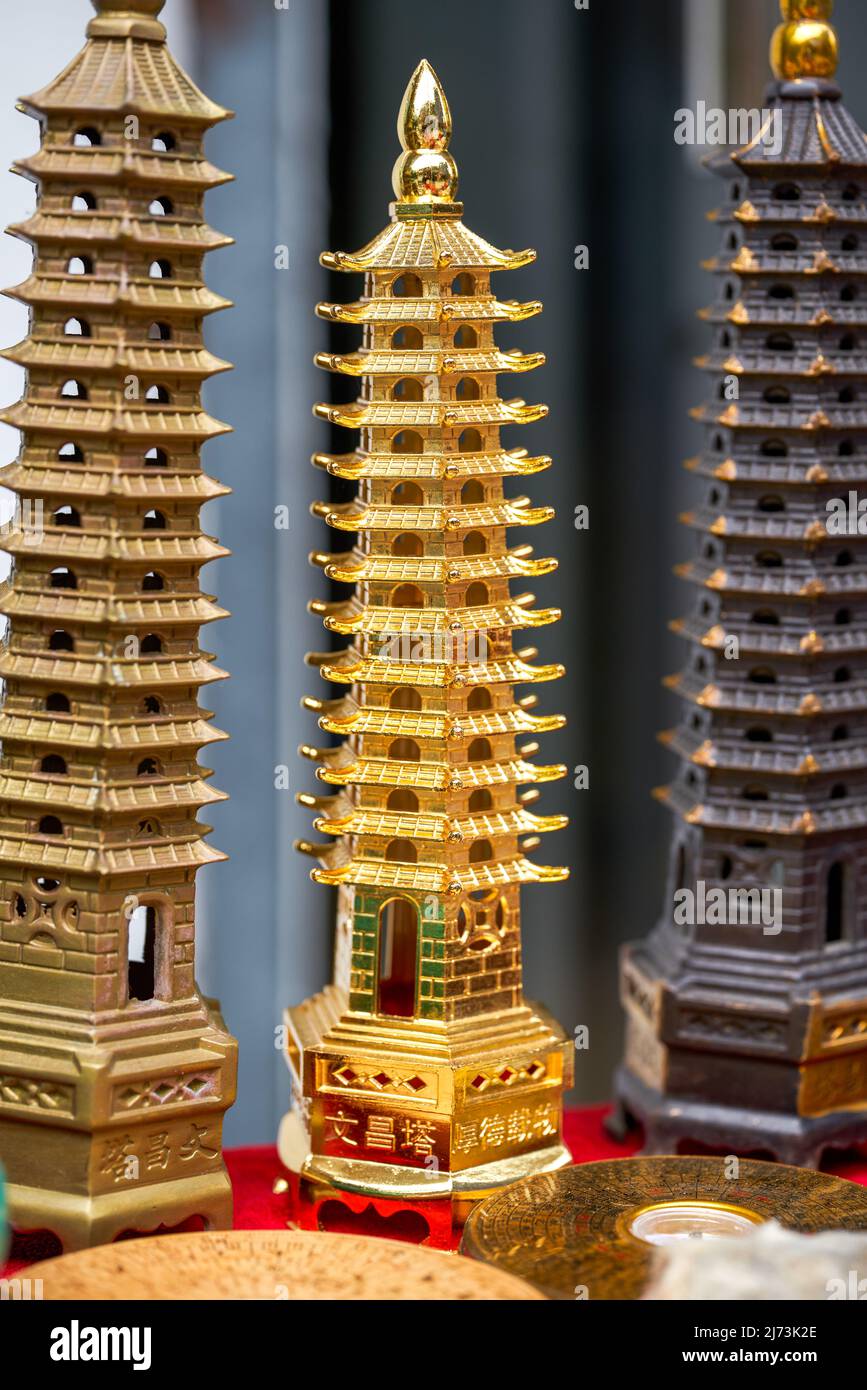 Traditional Chinese metal pagoda for sale in the market Stock Photo - Alamy