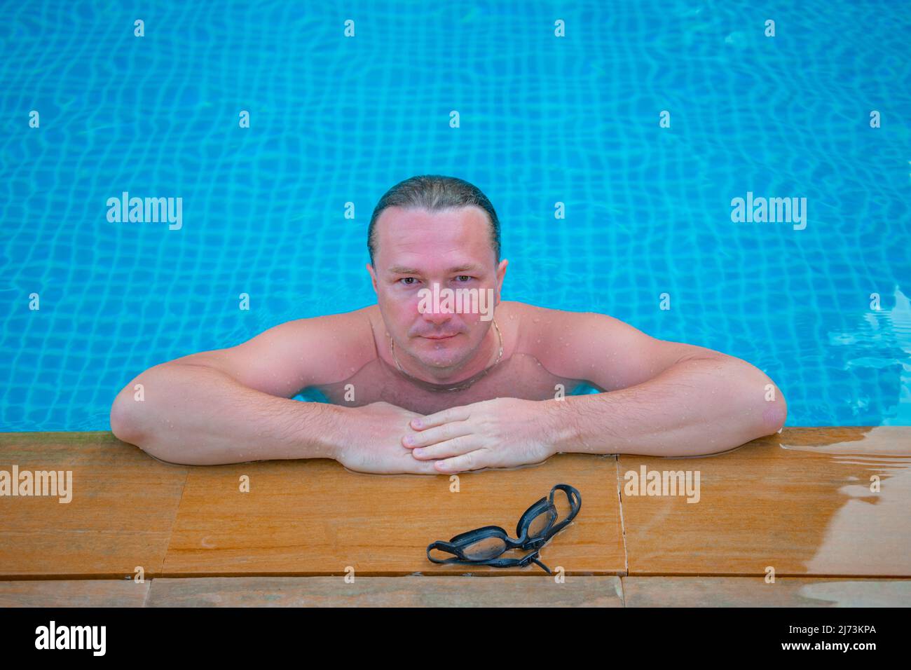 sad man swims in a deep pool Stock Photo - Alamy