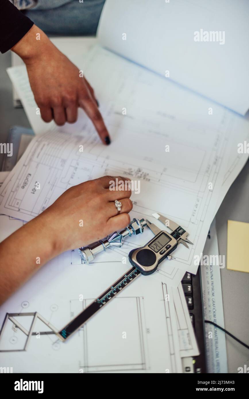 Engineer technician designing drawings mechanical parts engineering ...