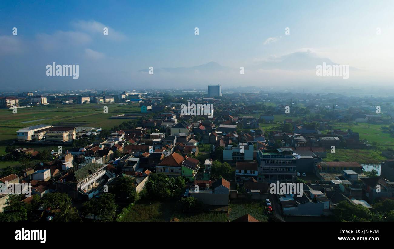 Aerial view of quiet traffic on bandung street with skyscrapers during ...