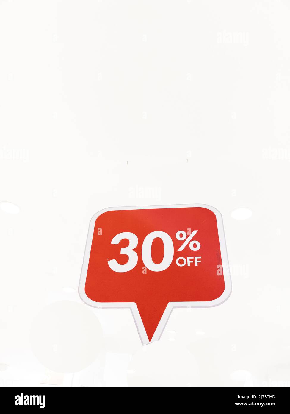 A discount sign reading 30 percent off in white background and copy ...