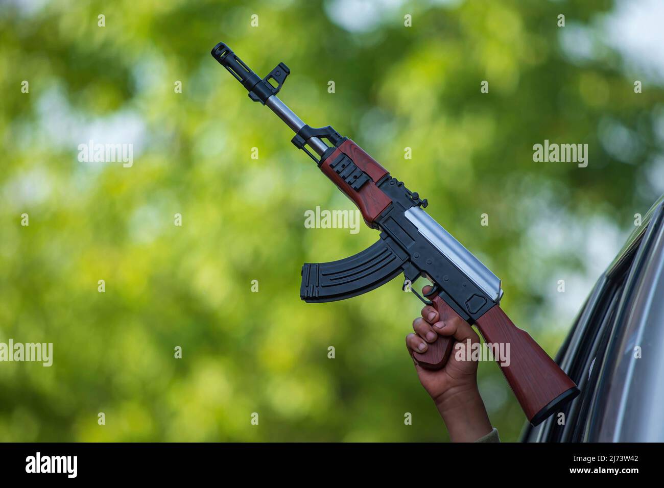 A toy gun held out by a Kashmiri Muslim boy as they play guns. As part ...