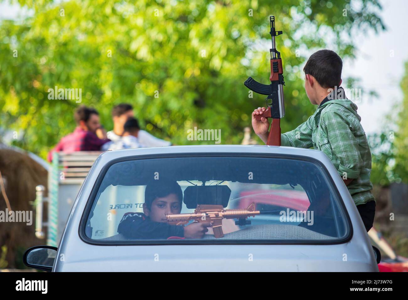 Kashmiri Muslim children play guns. As part of Eid-ul-Fitr celebrations ...