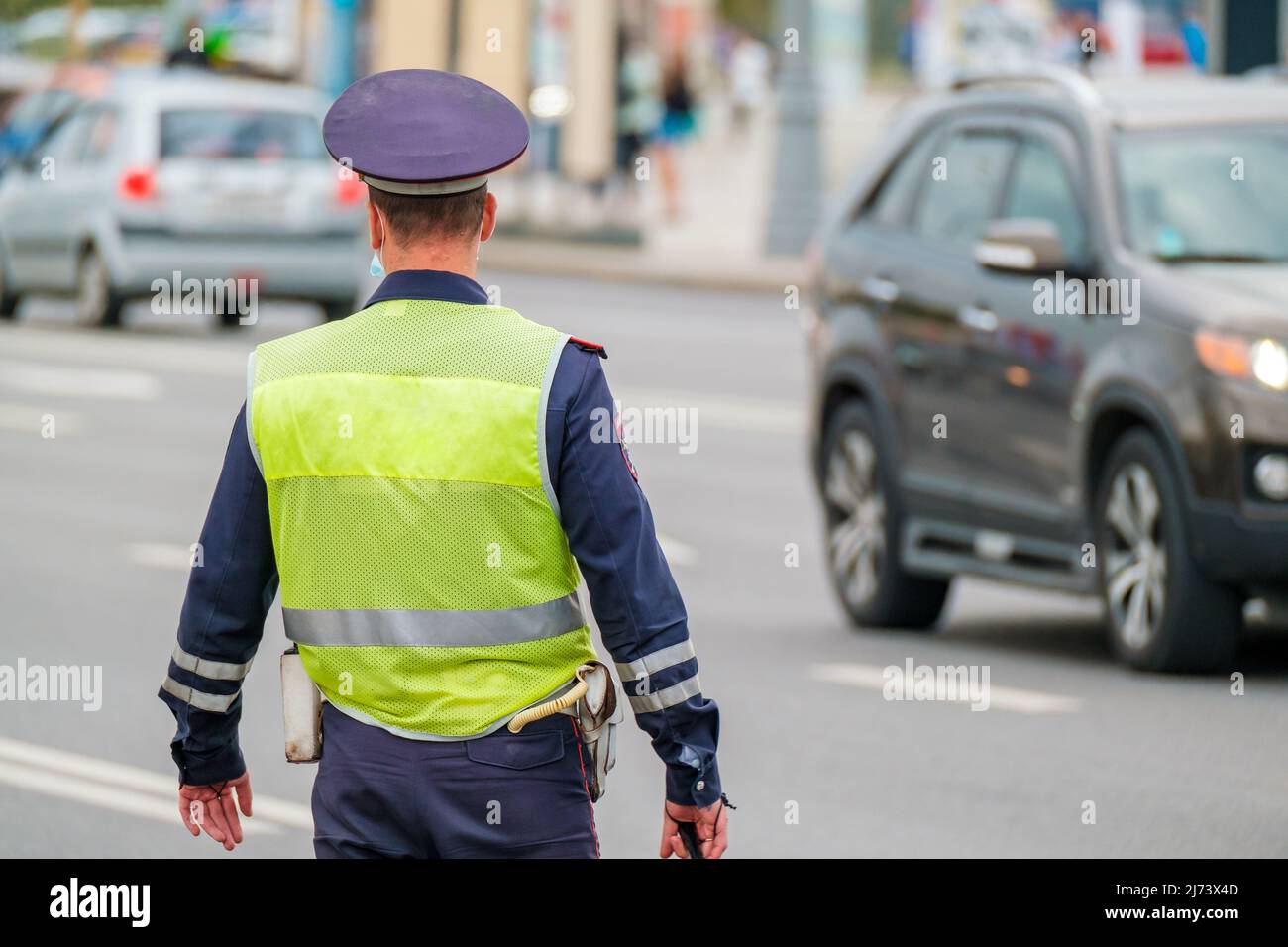 Traffic officer standing near road Stock Photo - Alamy