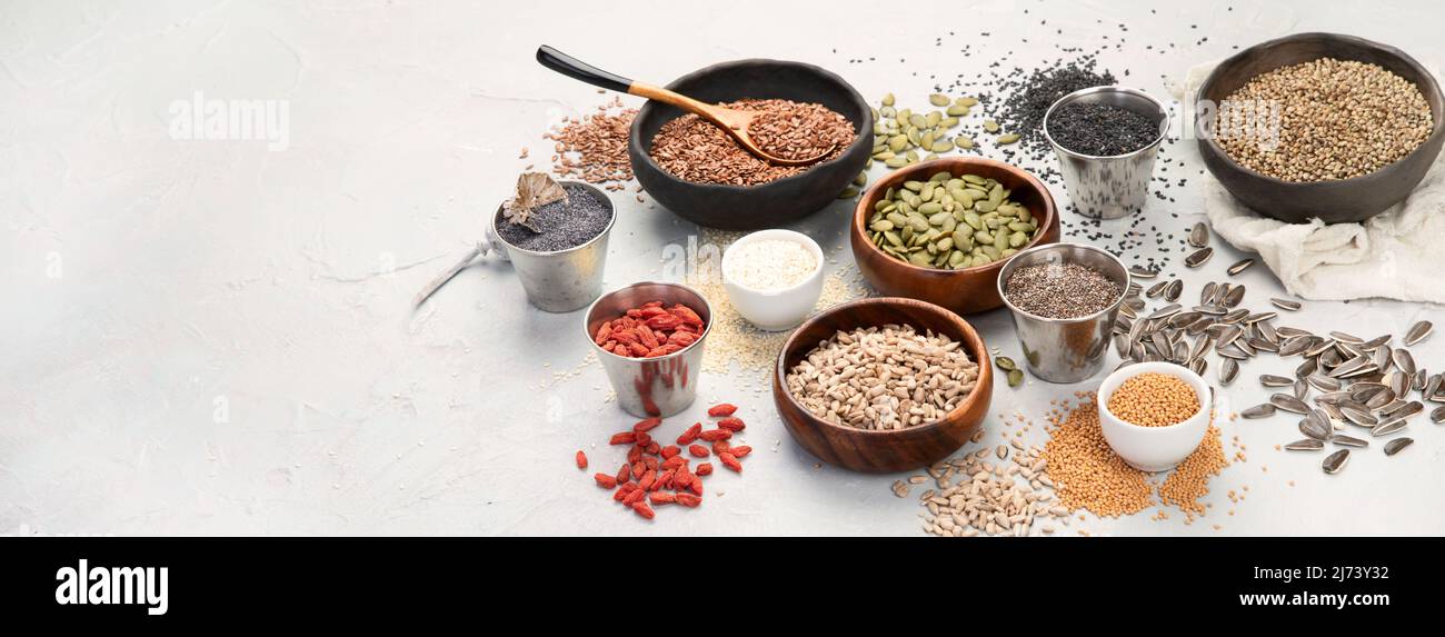Variety of edible seeds on light background. Cereal and grains. Healthy ...