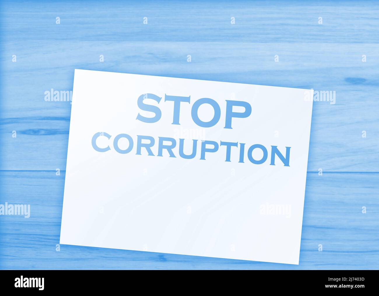 Stop Corruption Words on page and paper dollar signs around on wooden ...