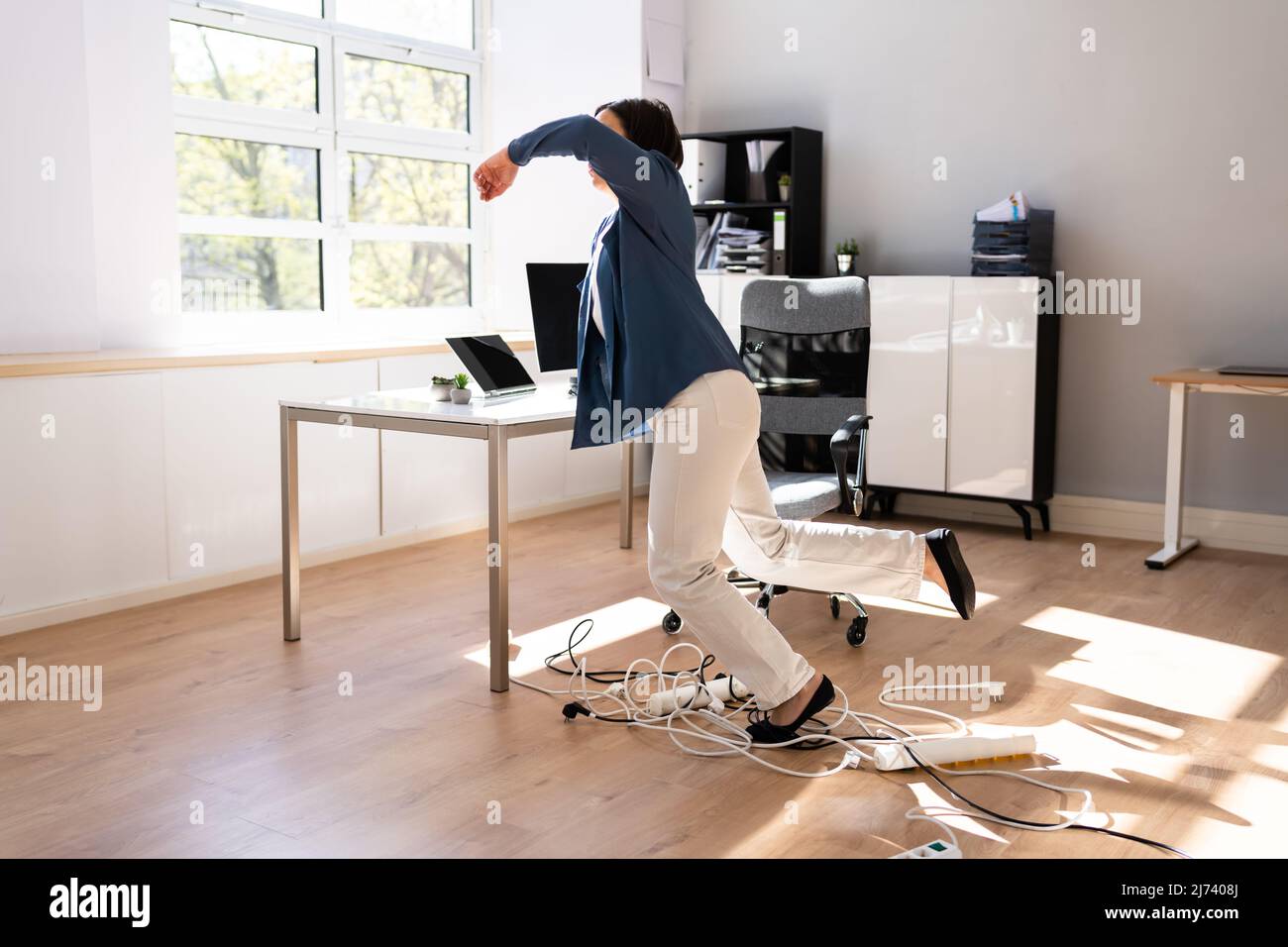 Stumble And Fall Over Wire In Office Stock Photo - Alamy