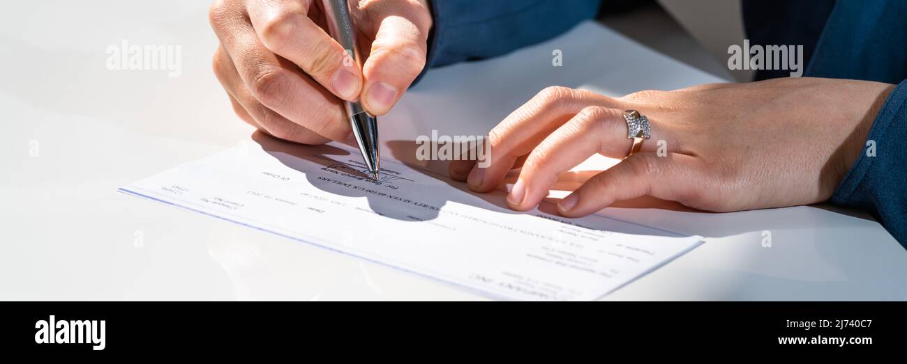 Insurance Paycheck. Payroll Check. Hand Writing Cheque Stock Photo - Alamy