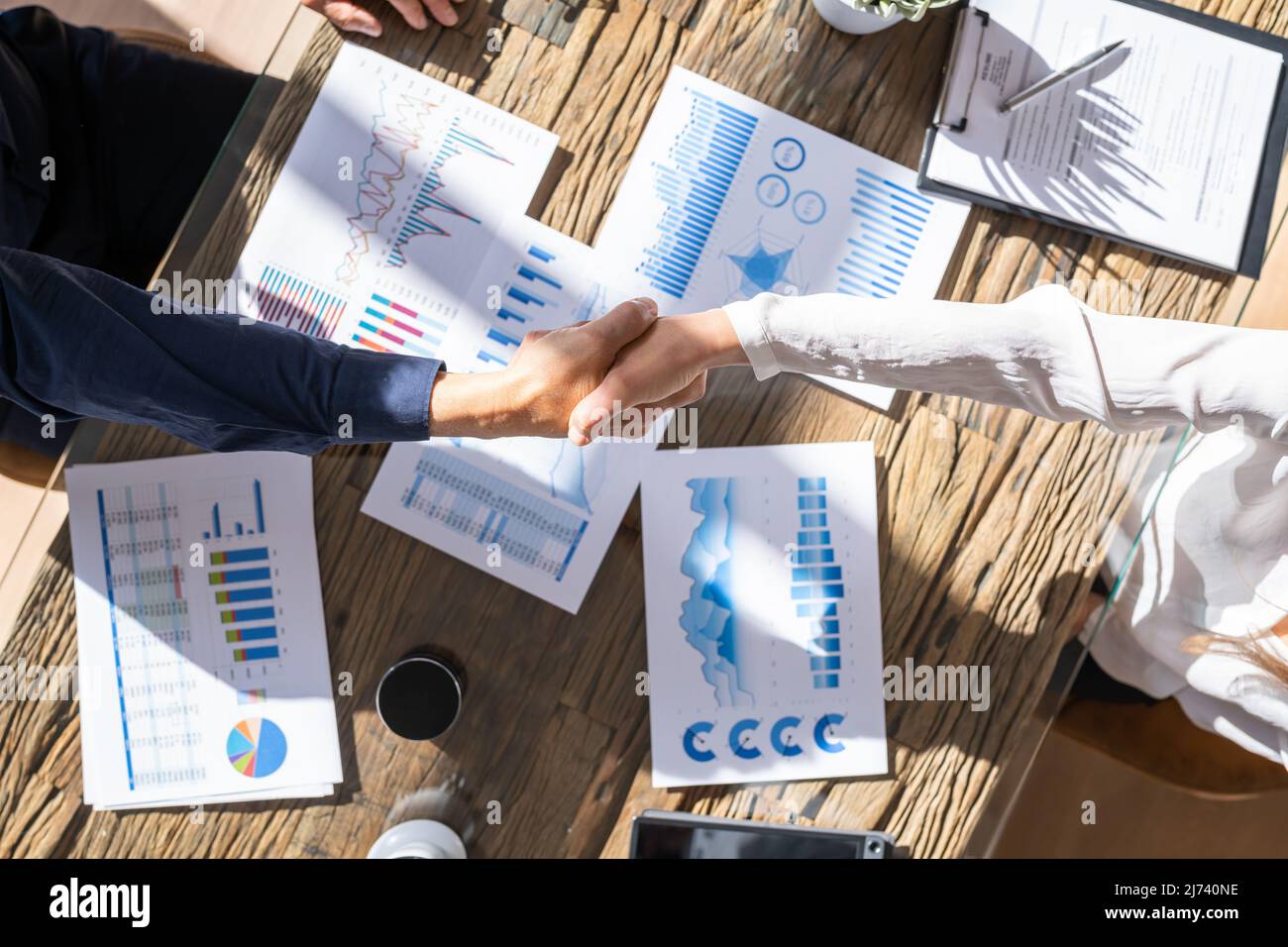 Financial Graph And Diagram. Analyst Shake Hands In Meeting Stock Photo ...