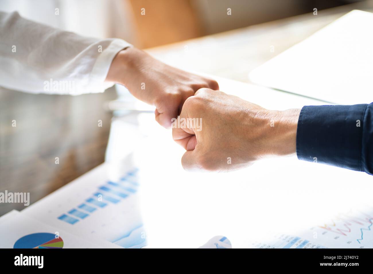 Financial Graph And Diagram. Analyst Fist Bump In Meeting Stock Photo ...