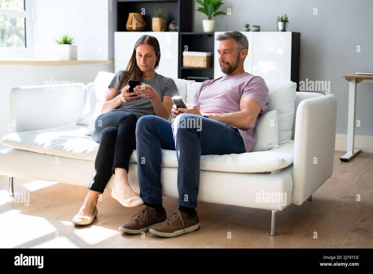 Couple Family Holding Mobile Phones In Hand. Smartphone Texting Stock ...