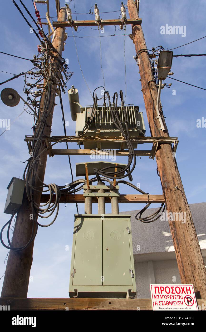 Outdated electricity supply, a mess of wires on wooden poles Stock ...